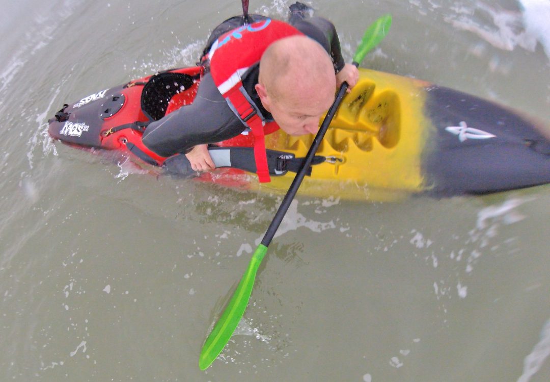 Getting back aboard your sit on top kayak after a wipe-out in waves ...